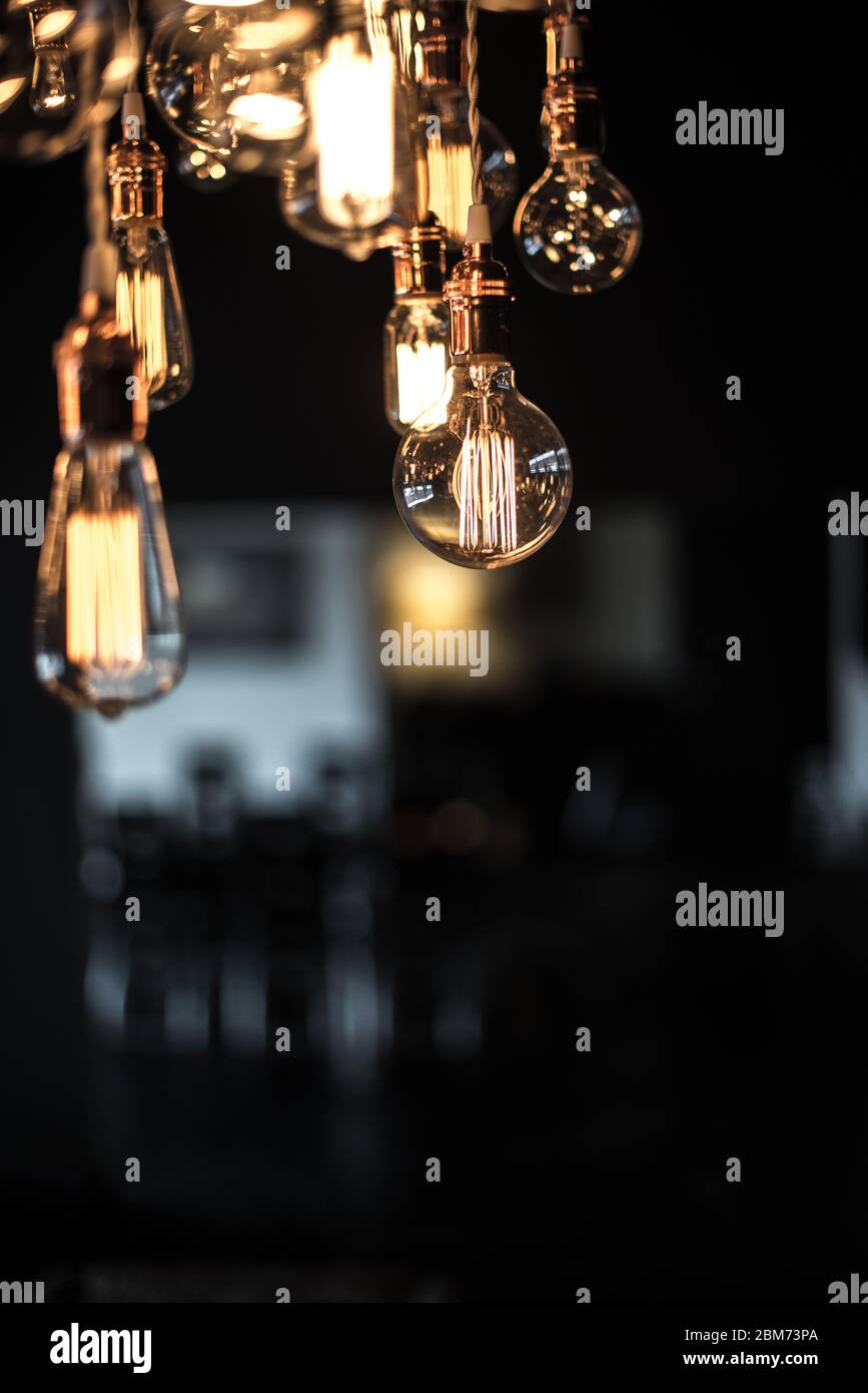 Hanging array of many incandescent light bulbs from ceiling Stock Photo ...