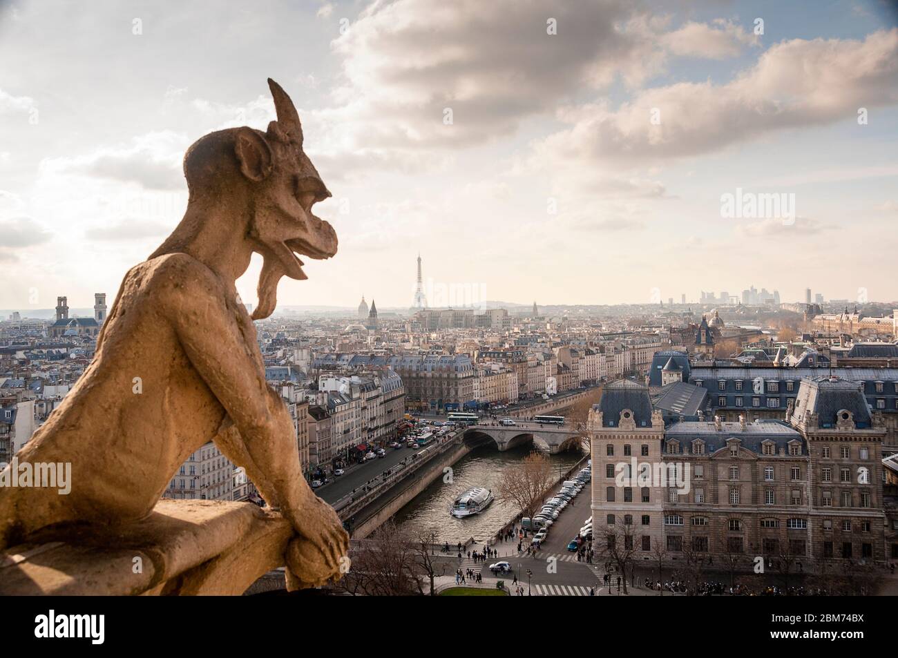 Gargoyle at Notre-Dame in Paris mythical grotesque viewed as both ...