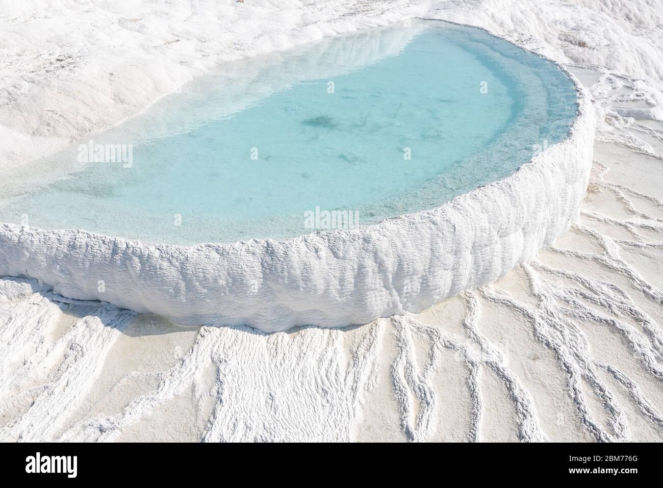 Blue steamy water of the spring in limestone pools in Pamukkale, Turkey ...