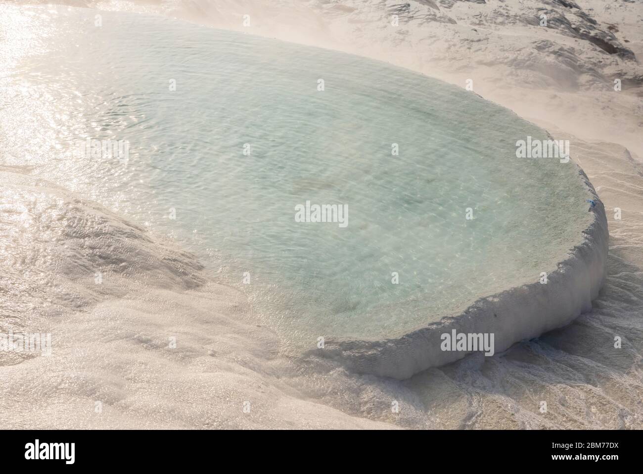 Blue steamy water of the spring in limestone pools in Pamukkale, Turkey ...