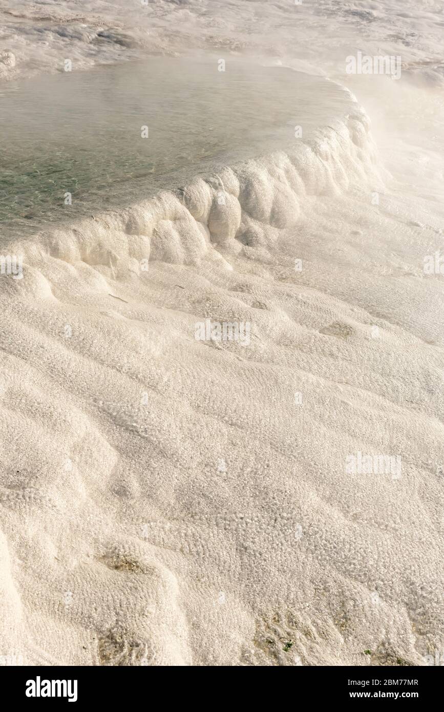 Blue steamy water of the spring in limestone pools in Pamukkale, Turkey ...