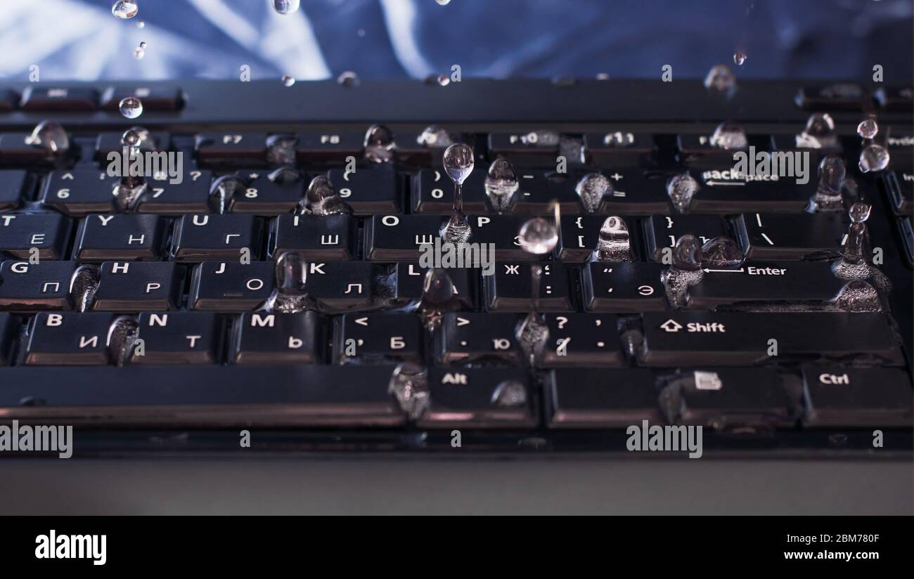 water dripping from the keyboard upwards close-up Stock Photo - Alamy