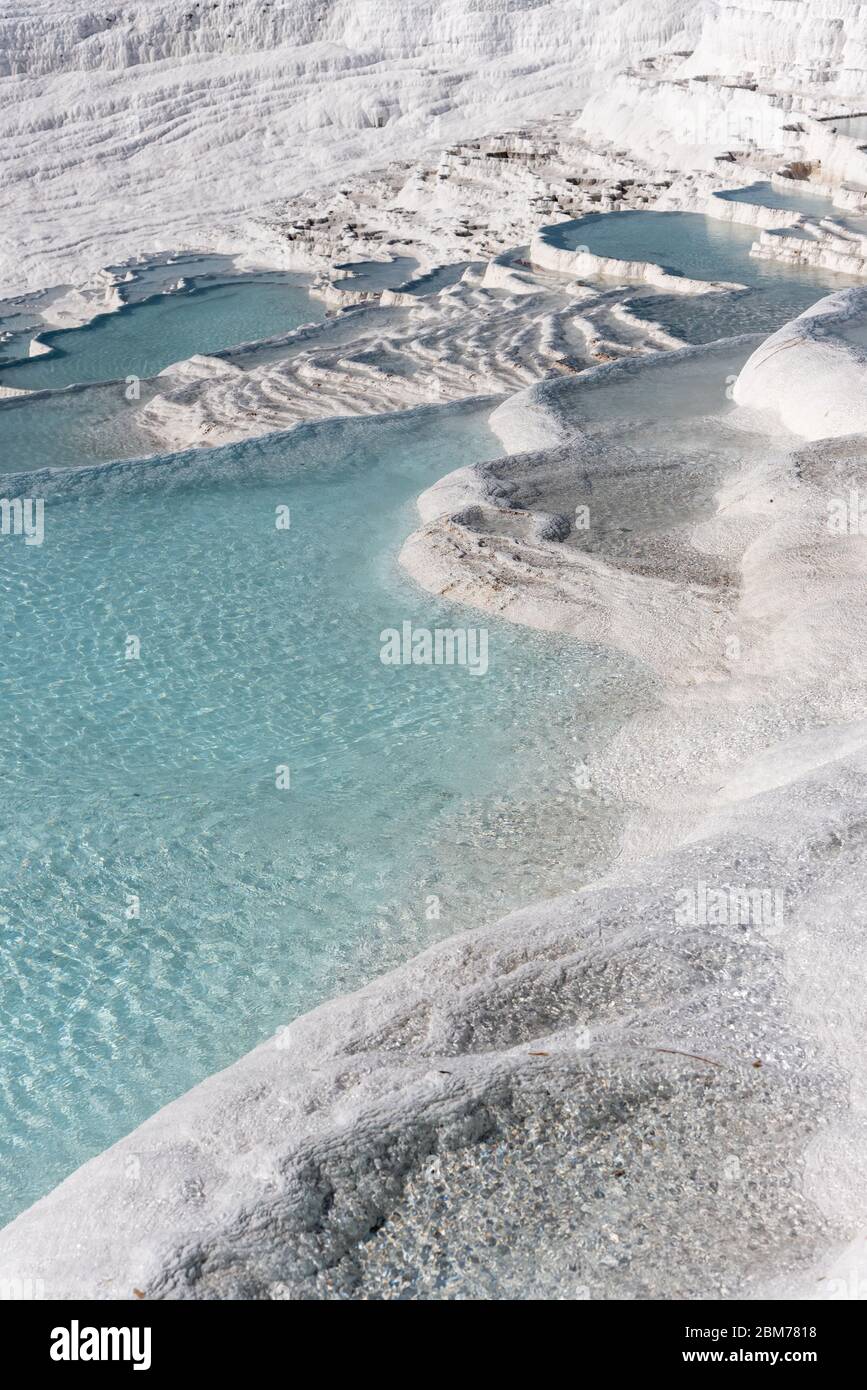 Blue steamy water of the spring in limestone pools in Pamukkale, Turkey ...