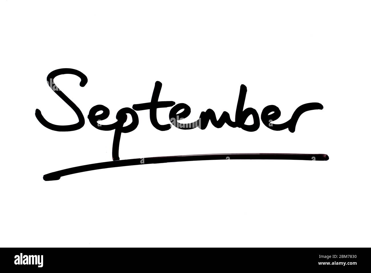 September handwritten on a white background Stock Photo - Alamy