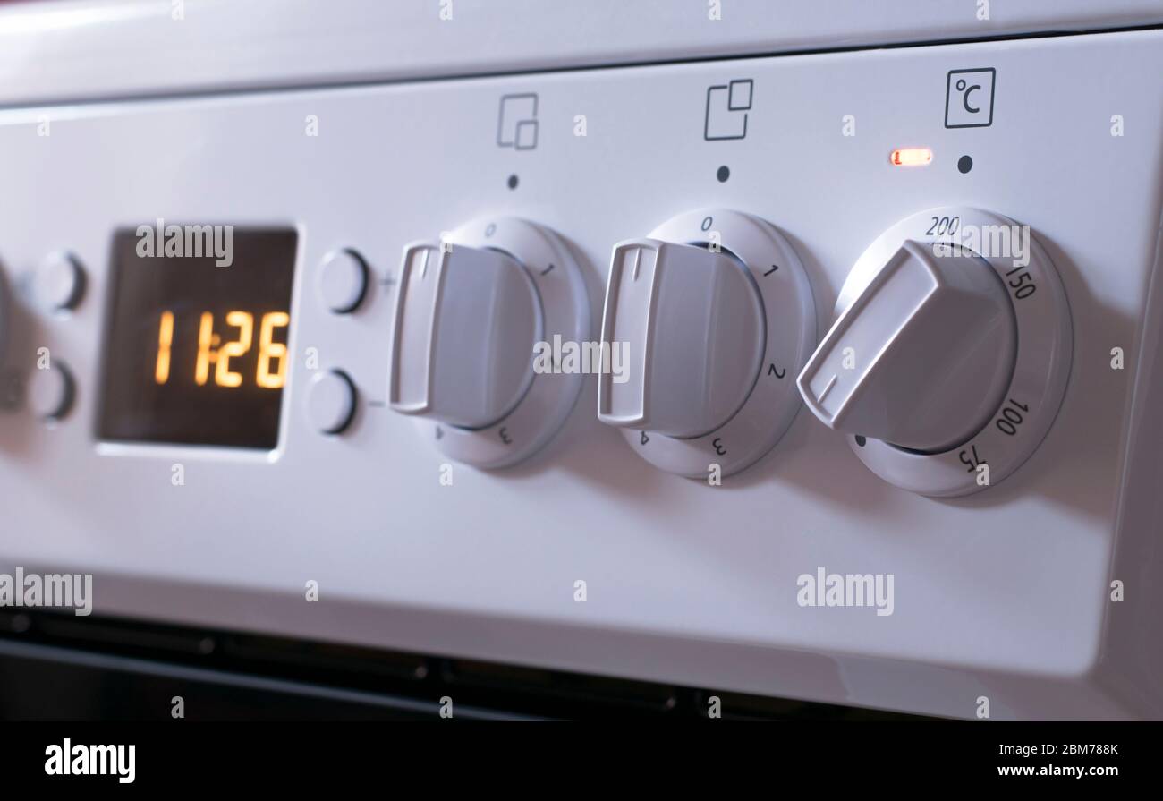 White switch power adjustment on the electric stove close-up Stock ...