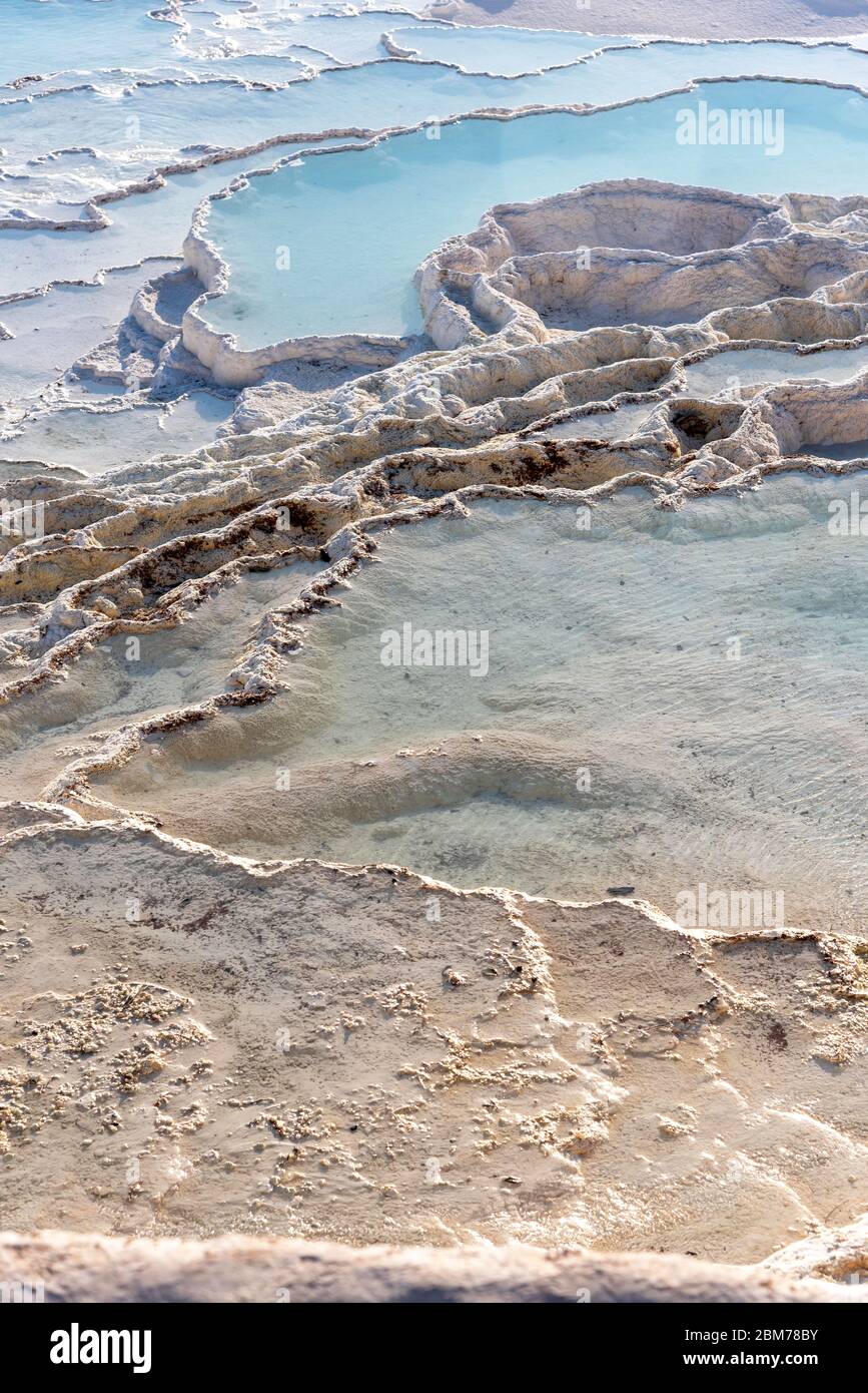 Blue steamy water of the spring in limestone pools in Pamukkale, Turkey ...