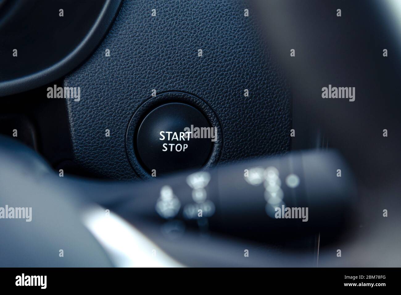 Engine start button in a modern car interior Stock Photo - Alamy