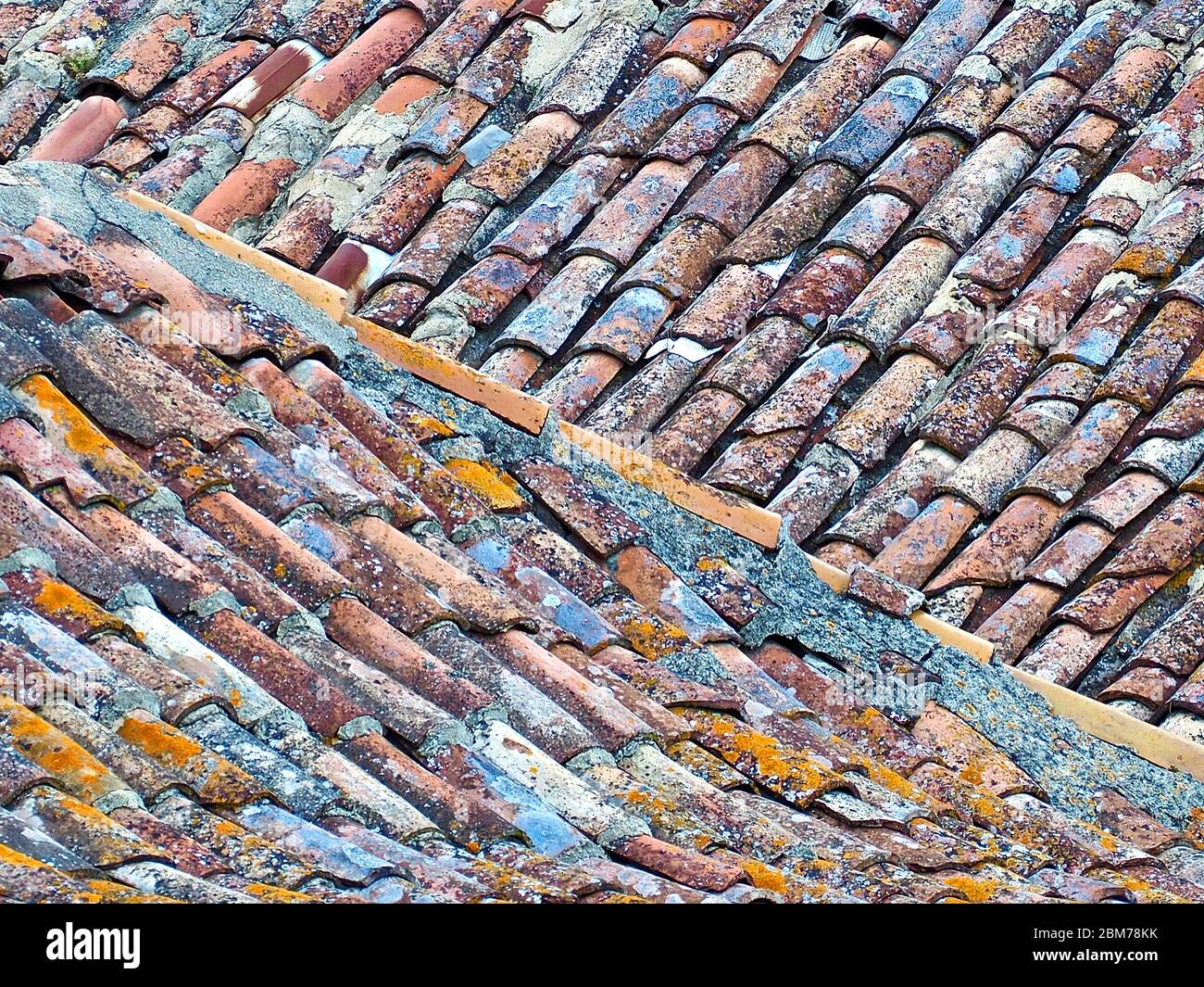Old roof with colorful roof tiles Stock Photo - Alamy