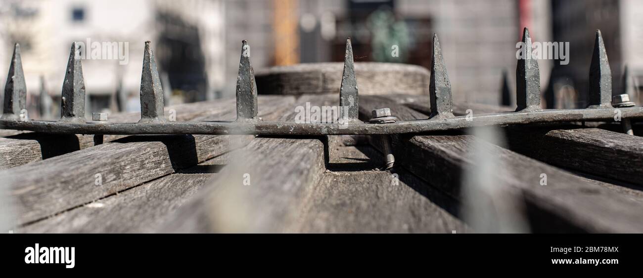 Metal protection of the historic well. Steel spikes. Historic ...