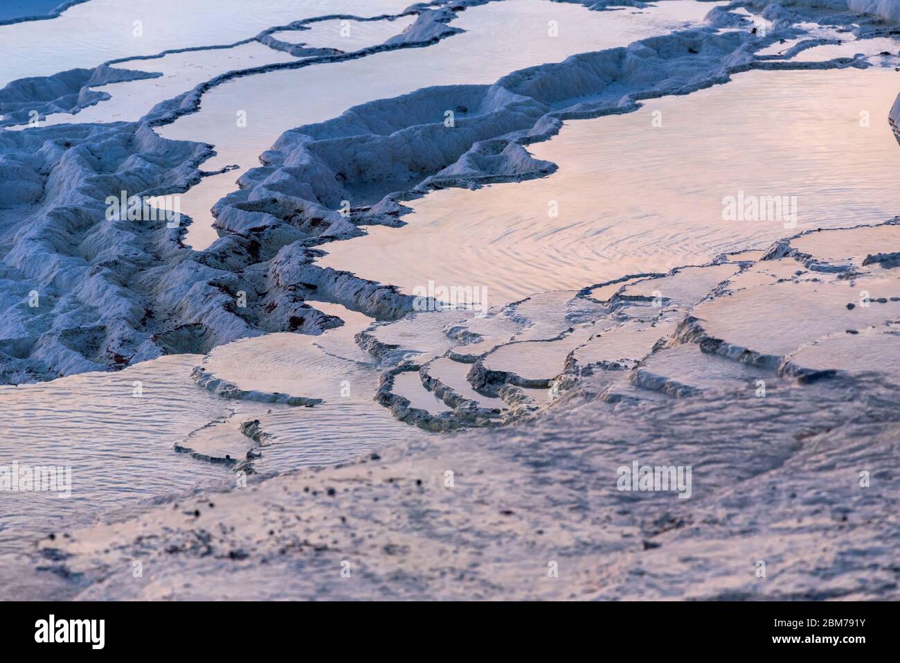 Steamy water of the spring in limestone pools in Pamukkale, Turkey ...