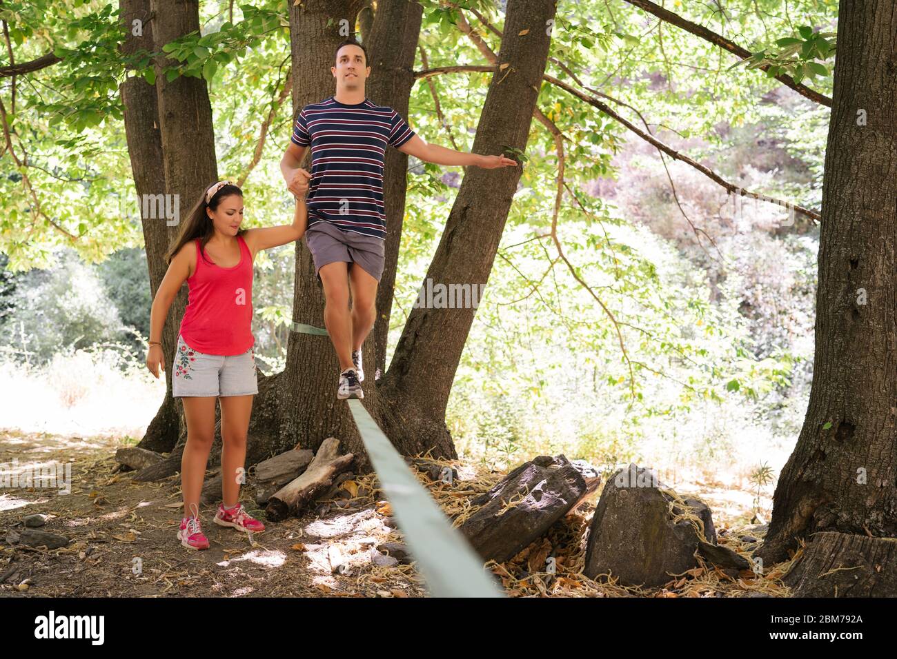 Highliner on a rope. Highline on a background of mountains. Extreme ...