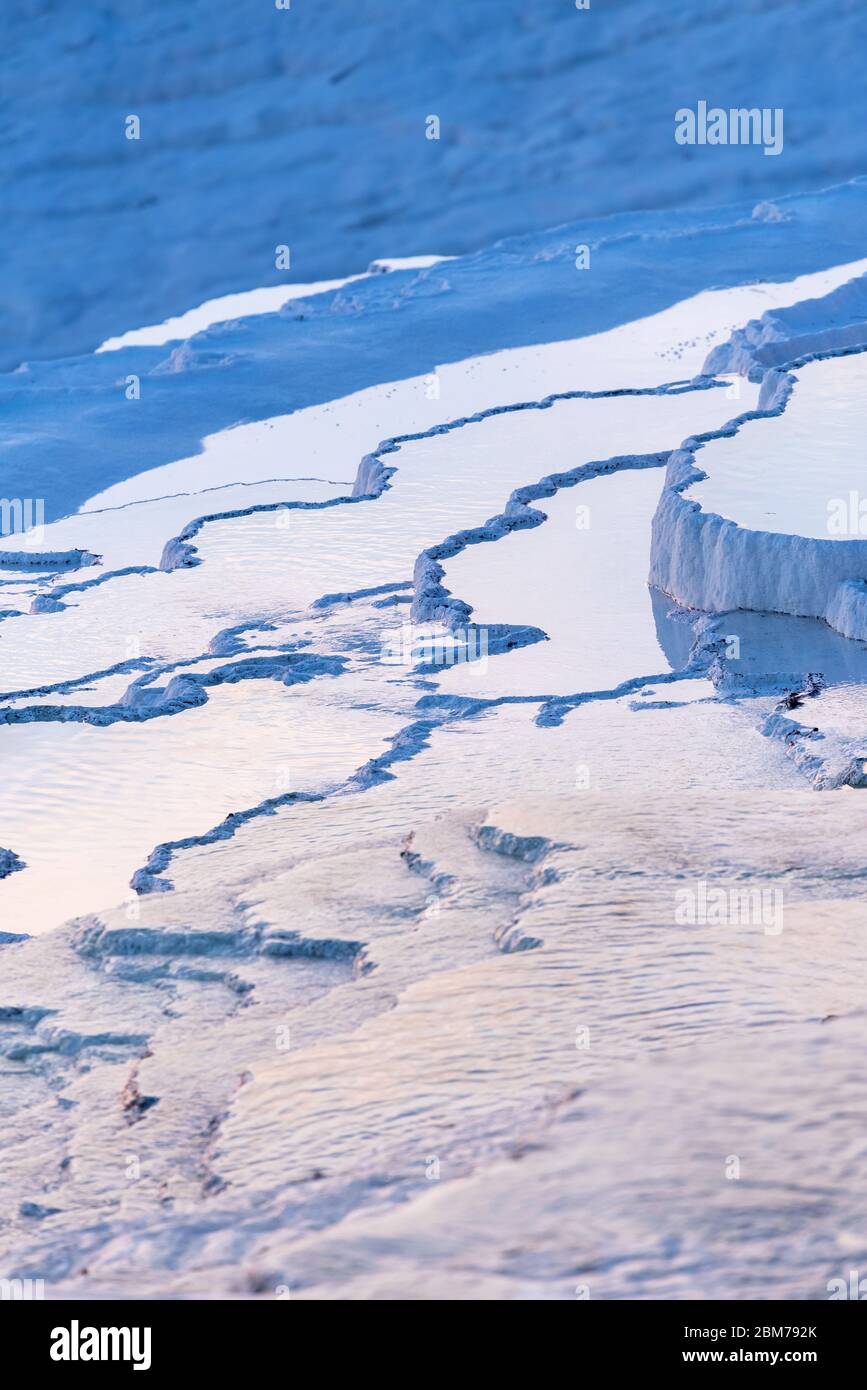 Blue steamy water of the spring in limestone pools in Pamukkale, Turkey ...