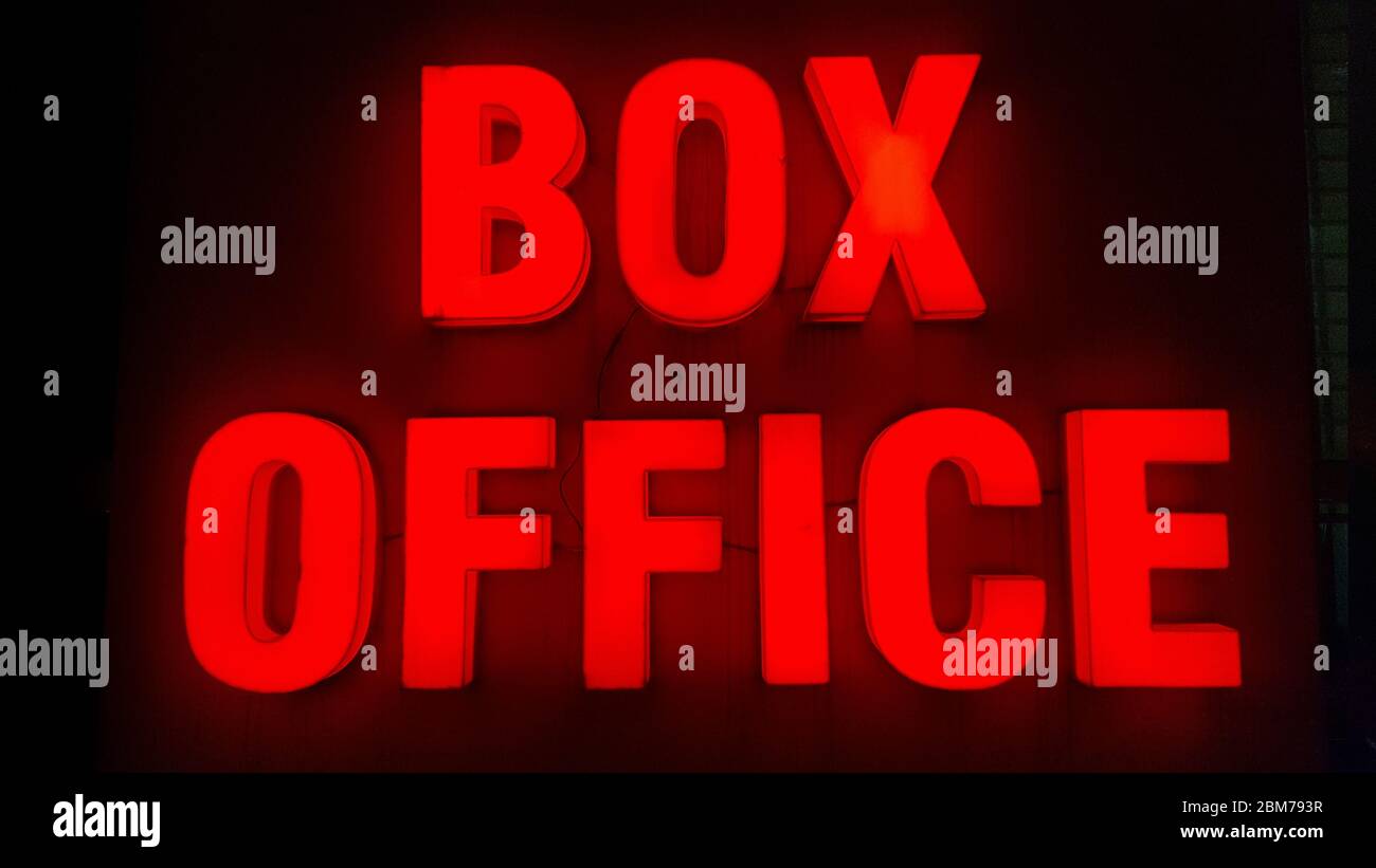 BOX OFFICE SIGN with red light on a wall at night Stock Photo - Alamy