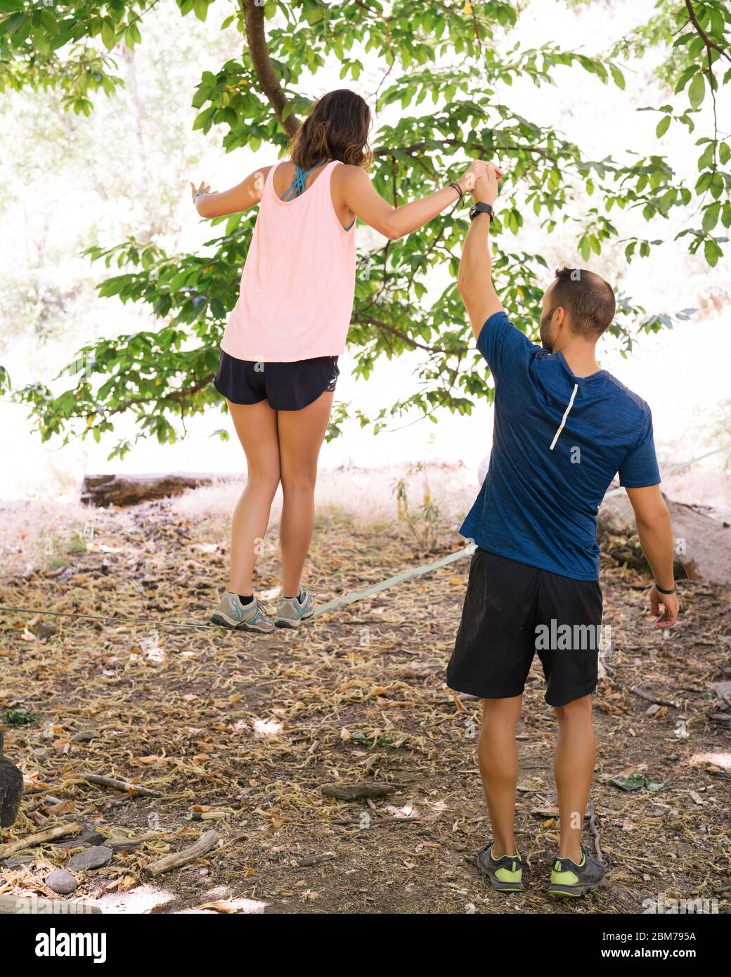 Highliner on a rope. Highline on a background of mountains. Extreme ...