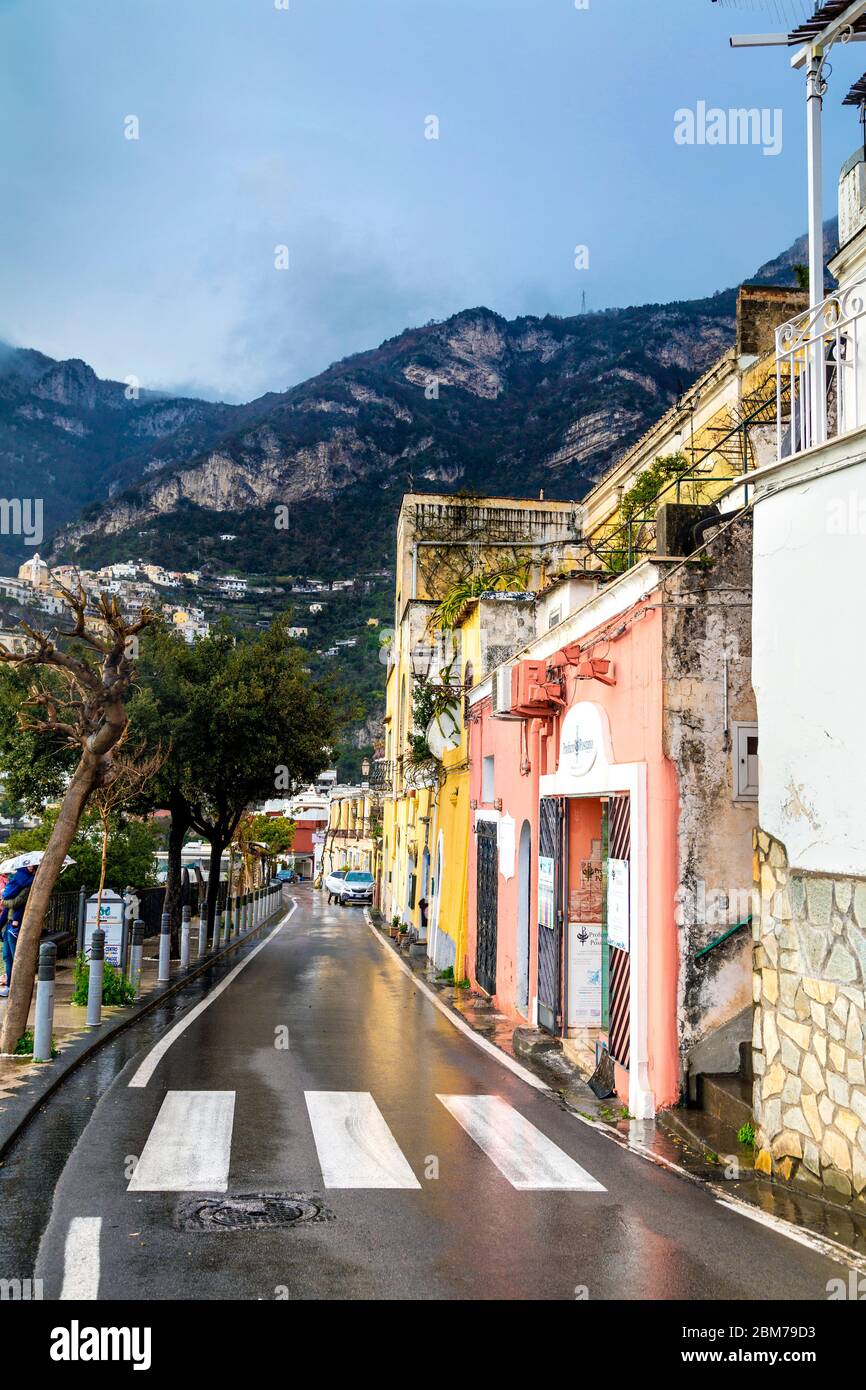 Colourful houses and street after a rainy day in Positano, Amalfi Coast ...