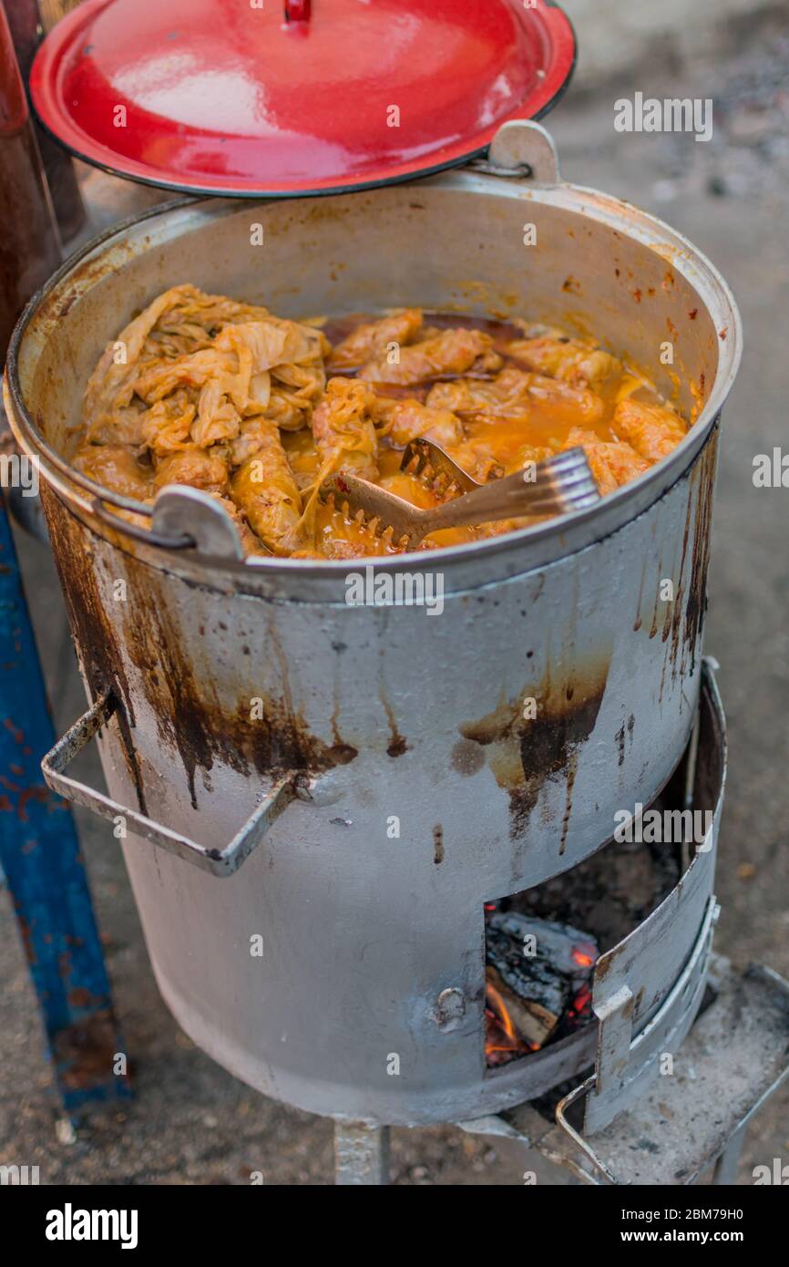Traditional romanian dish named "sarmale", prepared in traditional oven ...