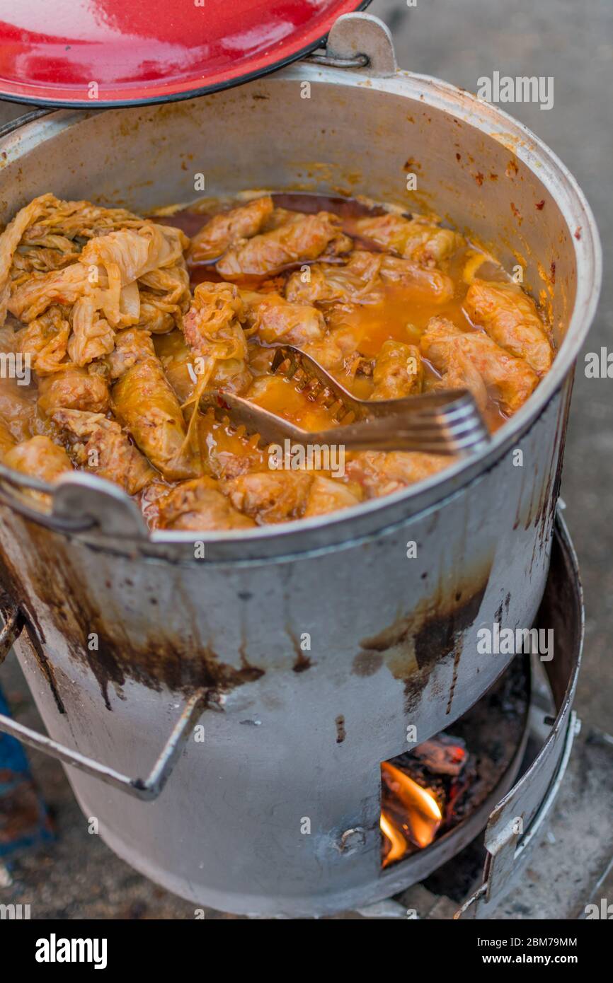 Traditional romanian dish named "sarmale", prepared in traditional oven ...
