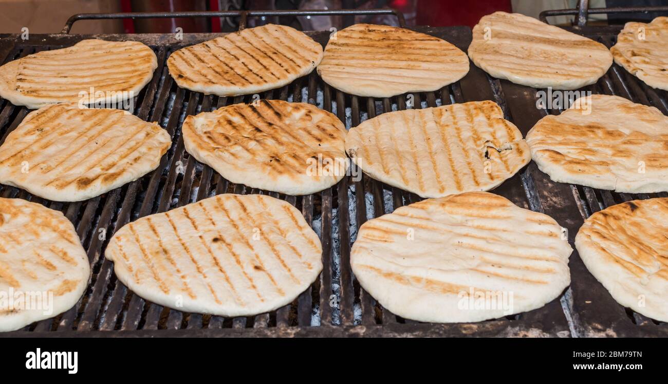 Pita bread on the grill during fast food festival, street food Stock ...