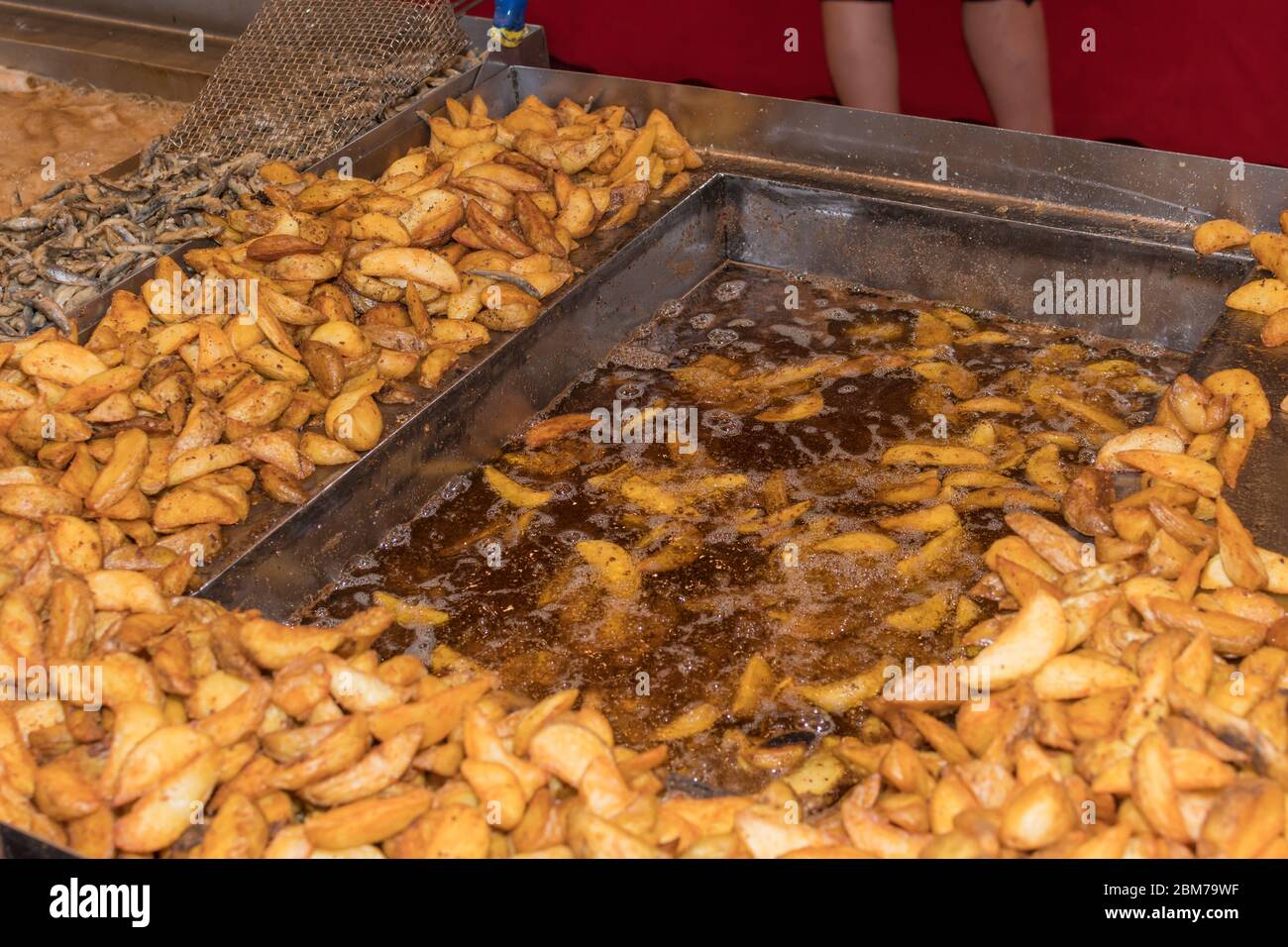 Deep fried fast food potatoes fries, during fast food festival Stock ...