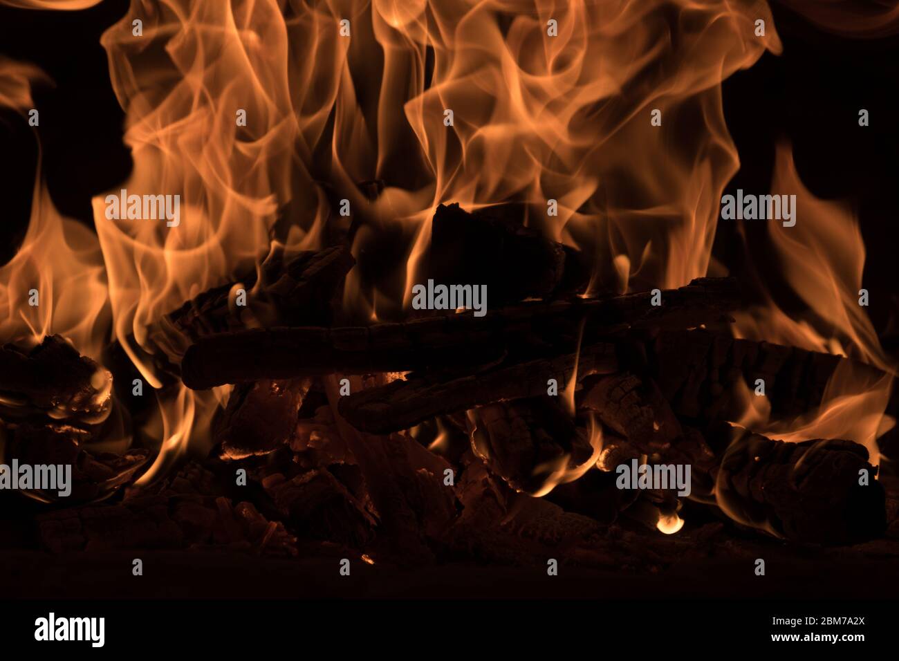 Fire and burn coals in stone oven. Oven made of brick and clay on the ...