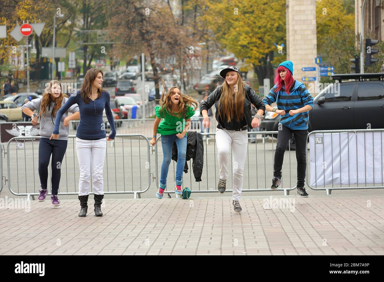 Group of young girls, street dancers, dancing on the pavement. May 21 ...