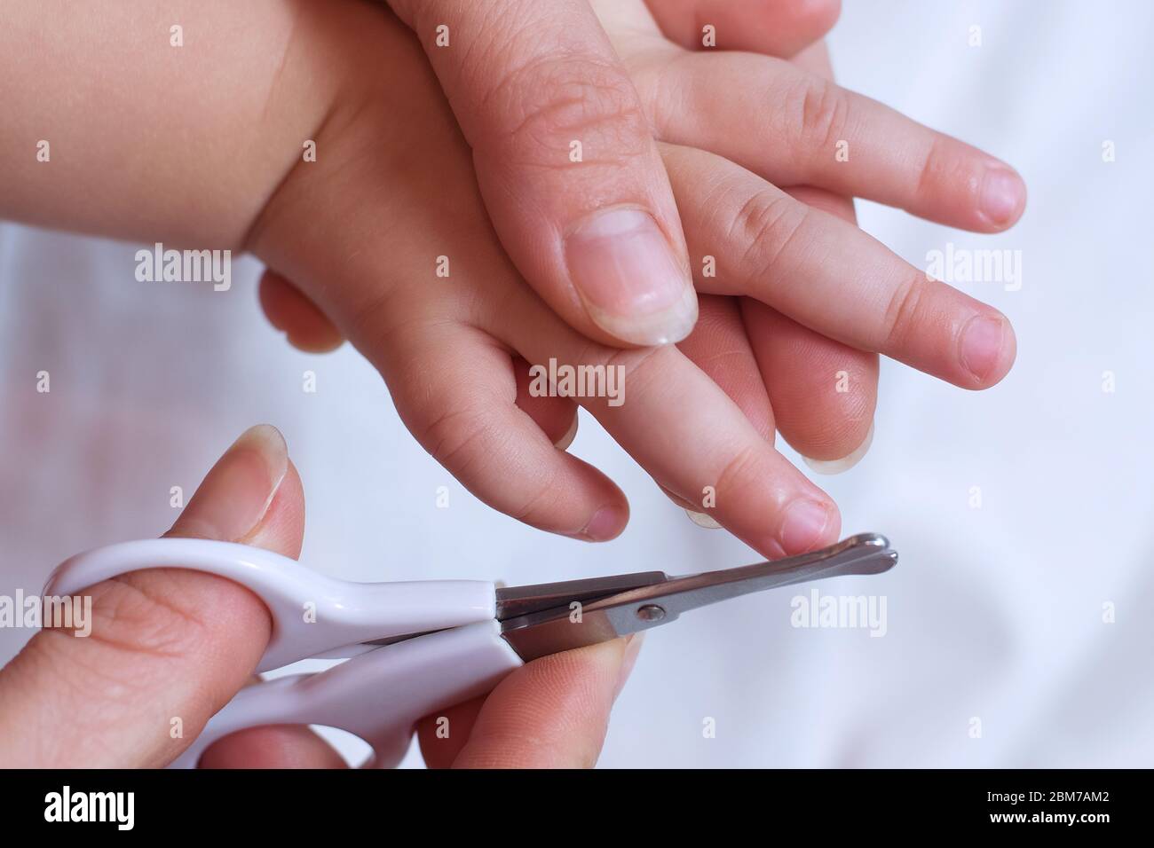 mum cuts a small child's fingernails close-up Stock Photo - Alamy
