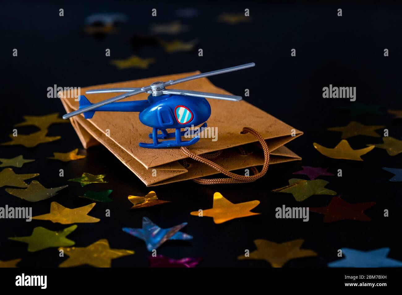 Blue Toy Helicopter Delivers Gift Paper Bag. Father's day, Birthday ...