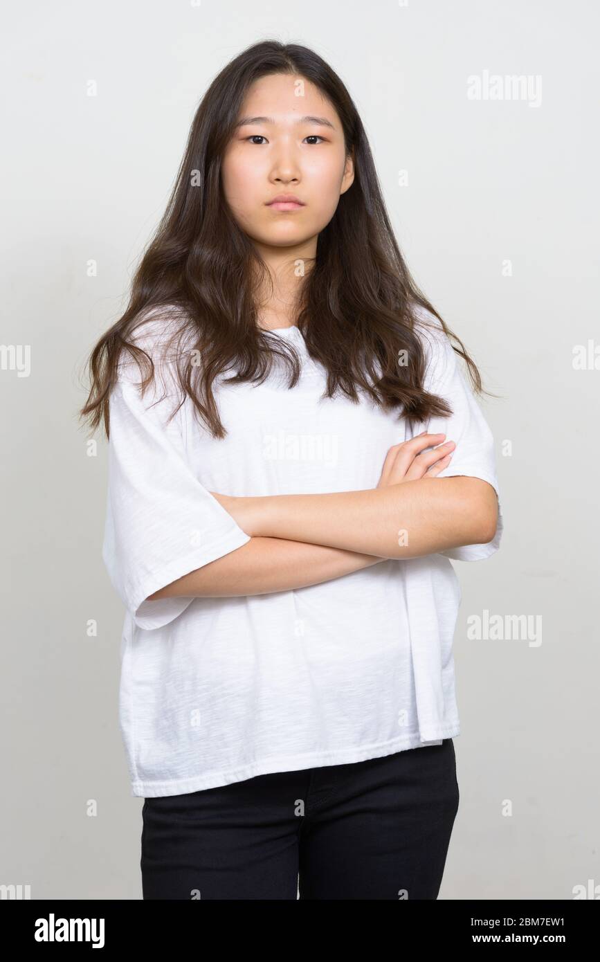 Portrait of young beautiful Asian woman with arms crossed Stock Photo ...