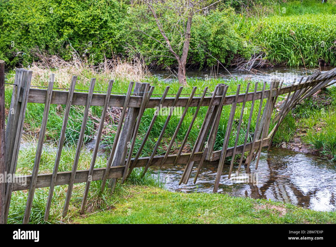 Fence Crossing Fishing Creek Stock Photo - Alamy