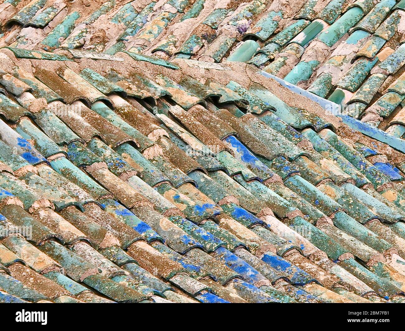 Old roof with colorful roof tiles Stock Photo - Alamy