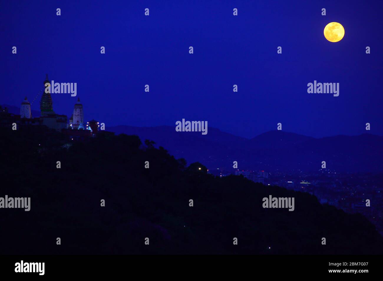 Kathmandu, Nepal. 07th May, 2020. Full moon rises over Swayambhunath ...