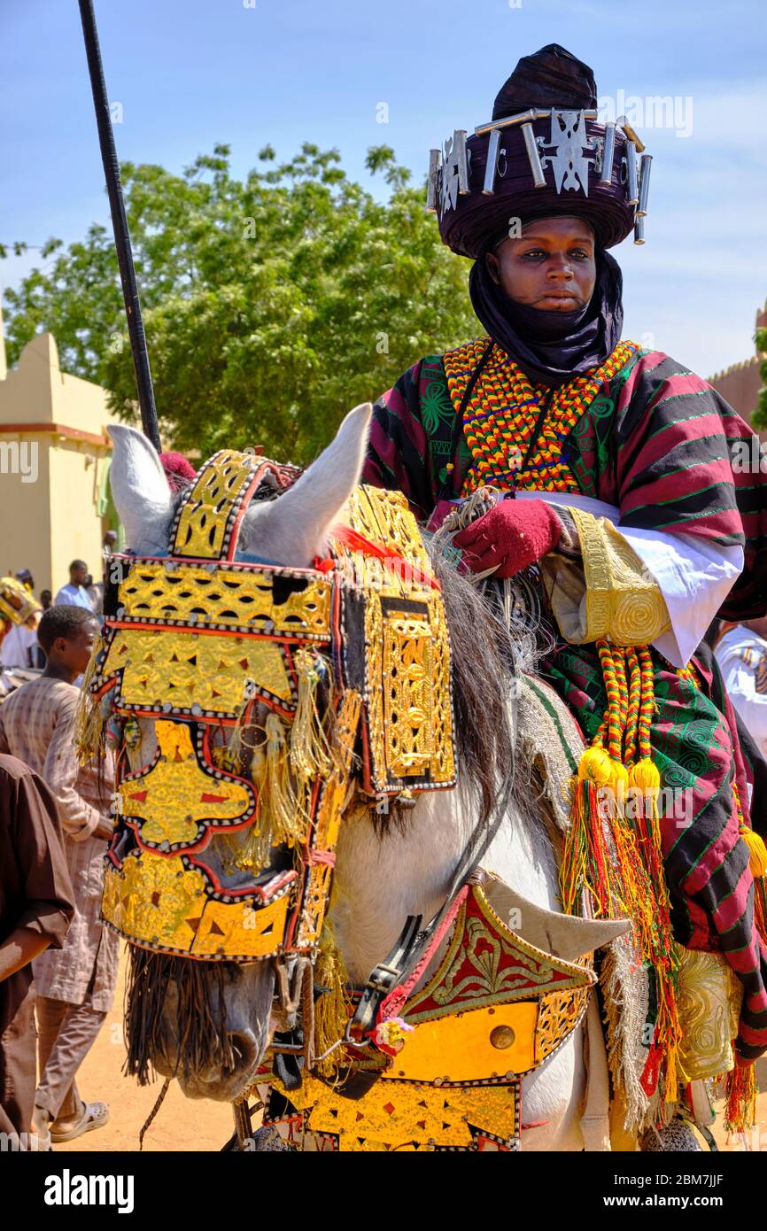 Nobleman rider dressed in a colourful outfit mounting an embellished ...