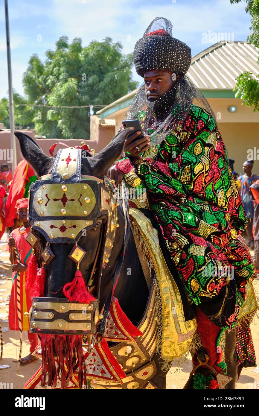 Nobleman rider dressed in a colourful outfit mounting an embellished ...