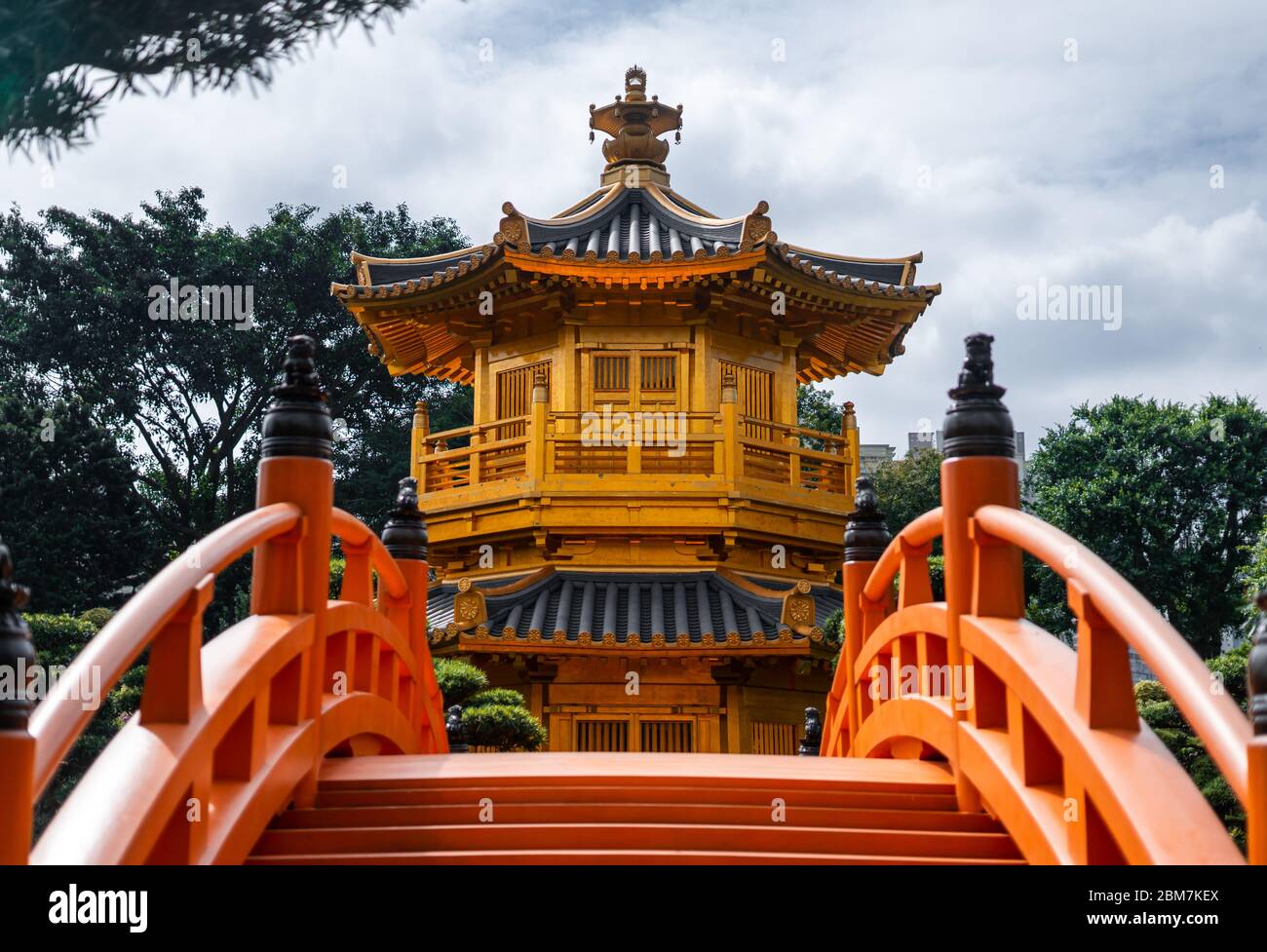 Traditional chinese yellow temple with garden and orange bridge Stock ...
