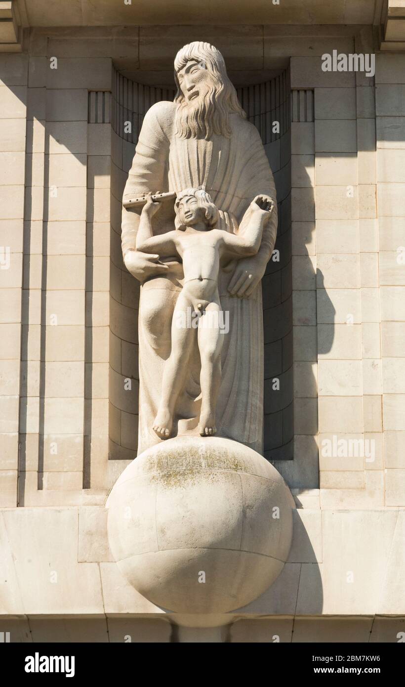 Eric Gill 's statue / sculpture Prospero And Ariel stands in front of ...