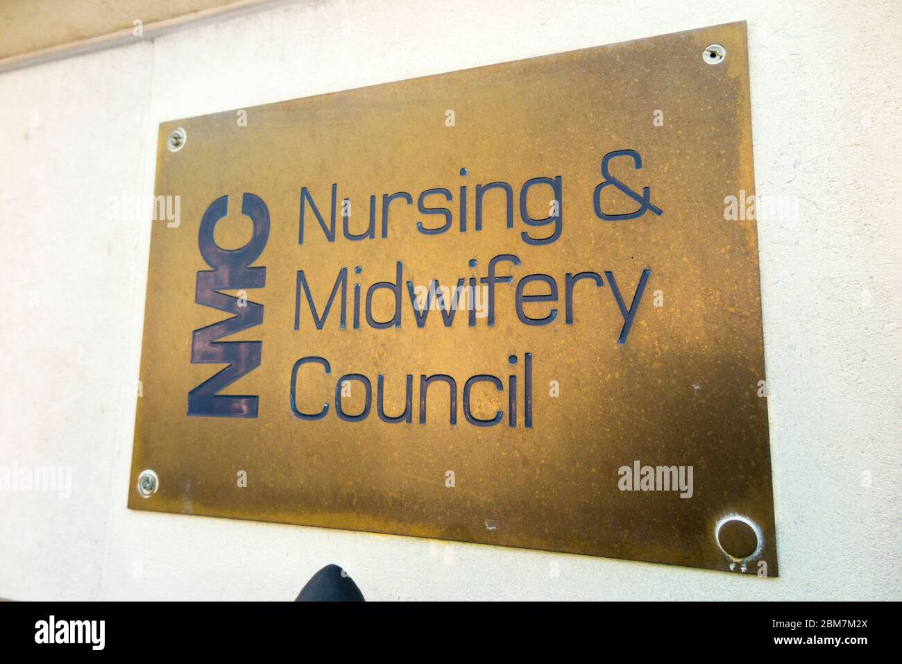 Brass name plate / plaque outside the offices of The Nursing and ...