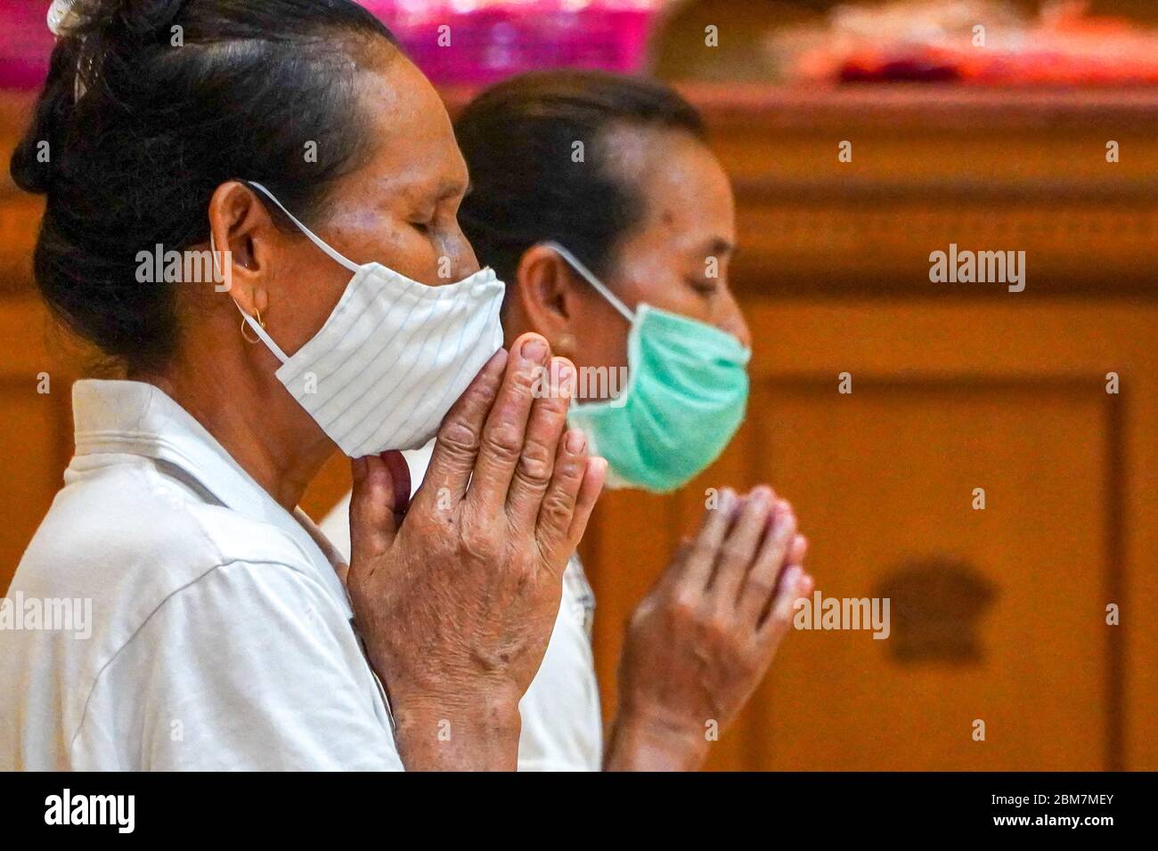 Organisers wearing face masks as a preventive measure take part during ...
