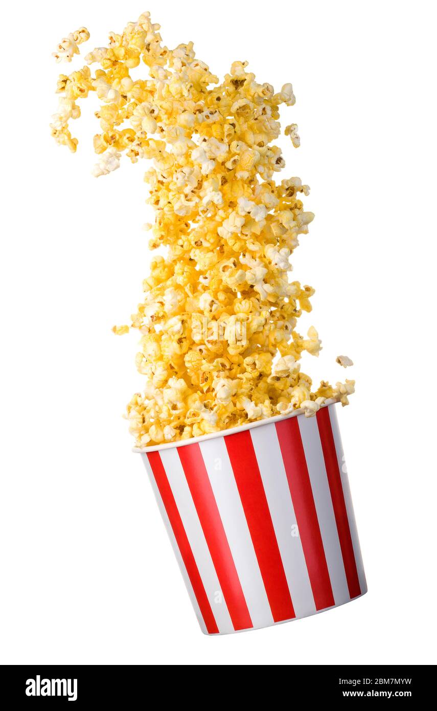 Flying popcorn from paper striped bucket isolated on black background ...