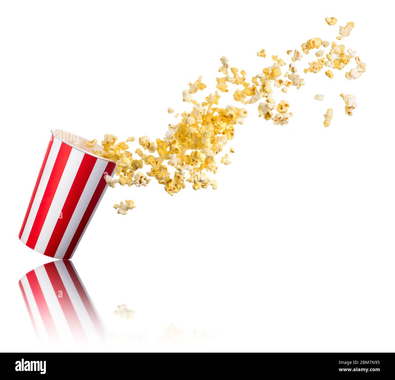 Flying popcorn from paper striped bucket isolated on white background ...