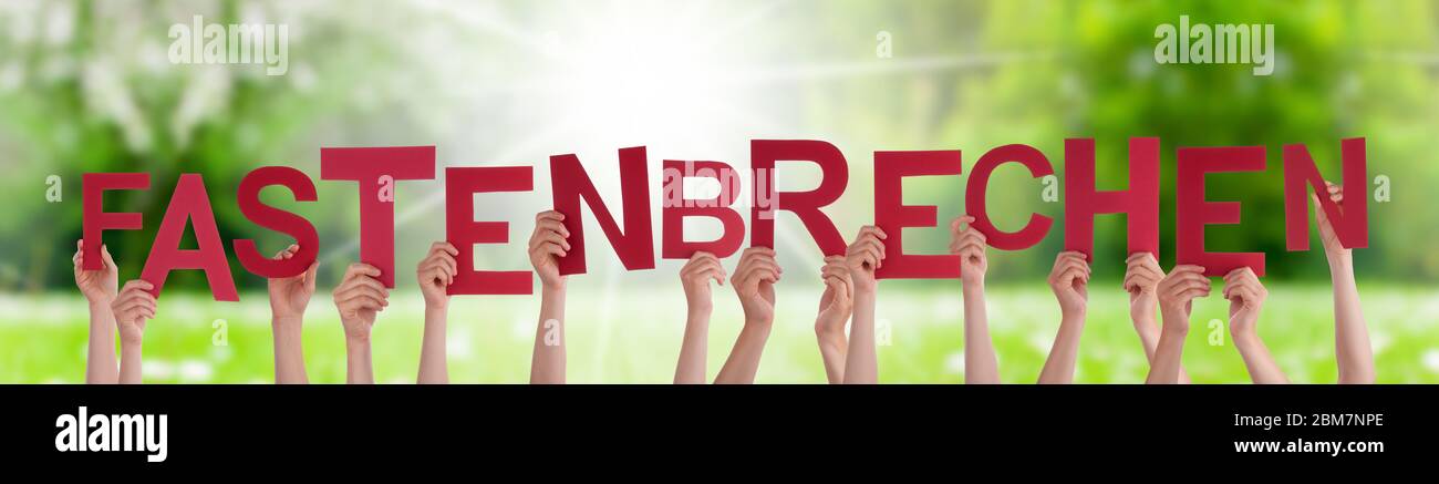 People Hands Holding Word Fastenbrechen Means Fast-Breaking, Grass ...