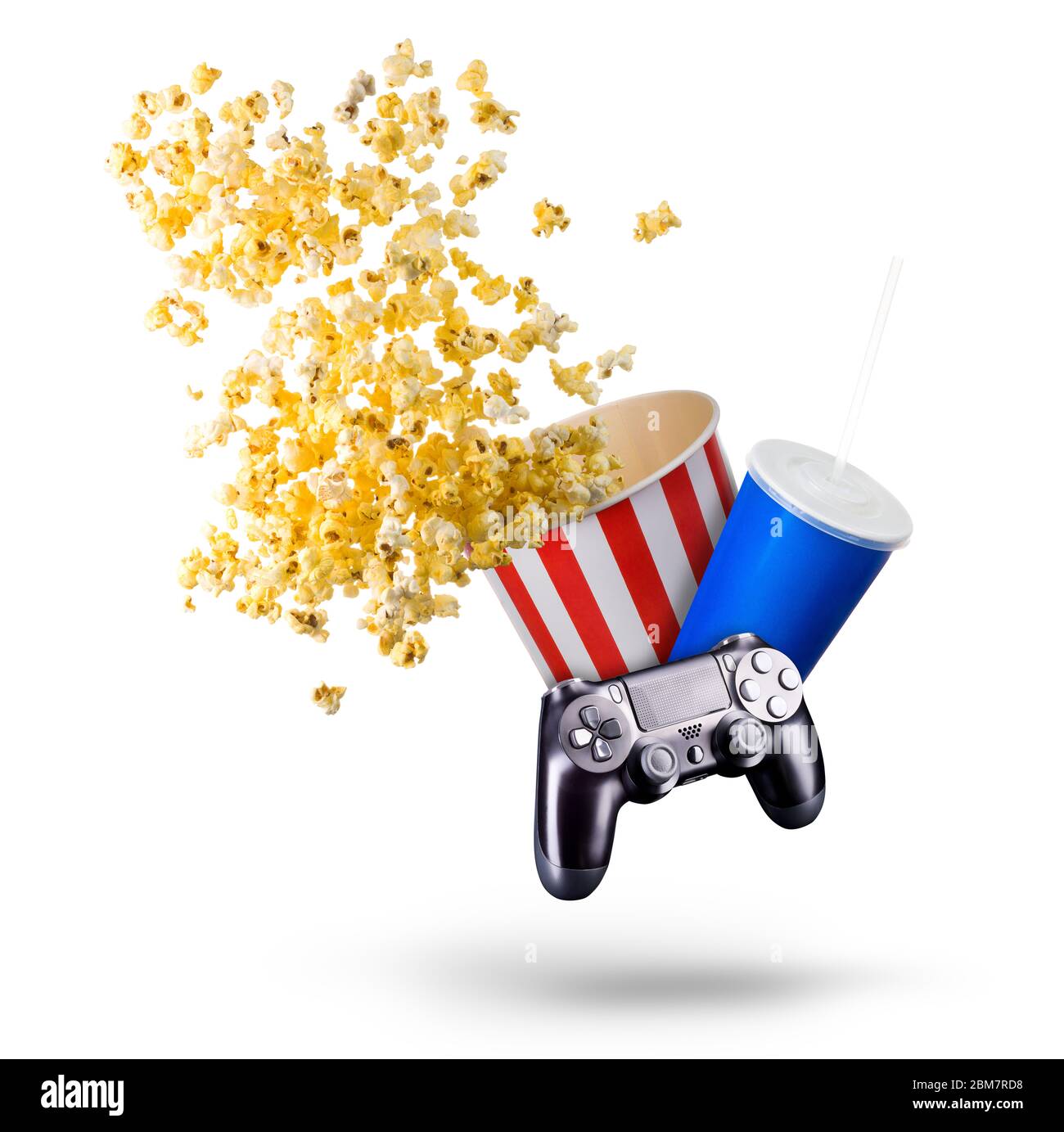 Paper bucket with popcorn, cup of drink and video game joystick on ...