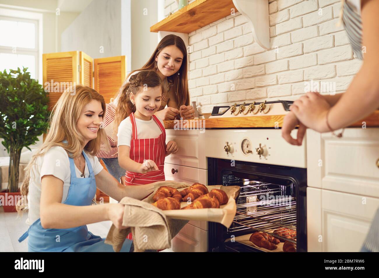 Mom and two kids bake hi-res stock photography and images - Alamy