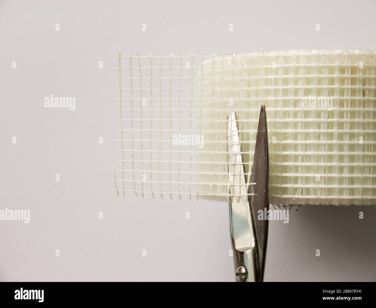The Sticky yellow mesh tape Stock Photo - Alamy