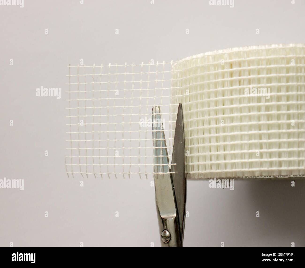 The Sticky yellow mesh tape Stock Photo - Alamy