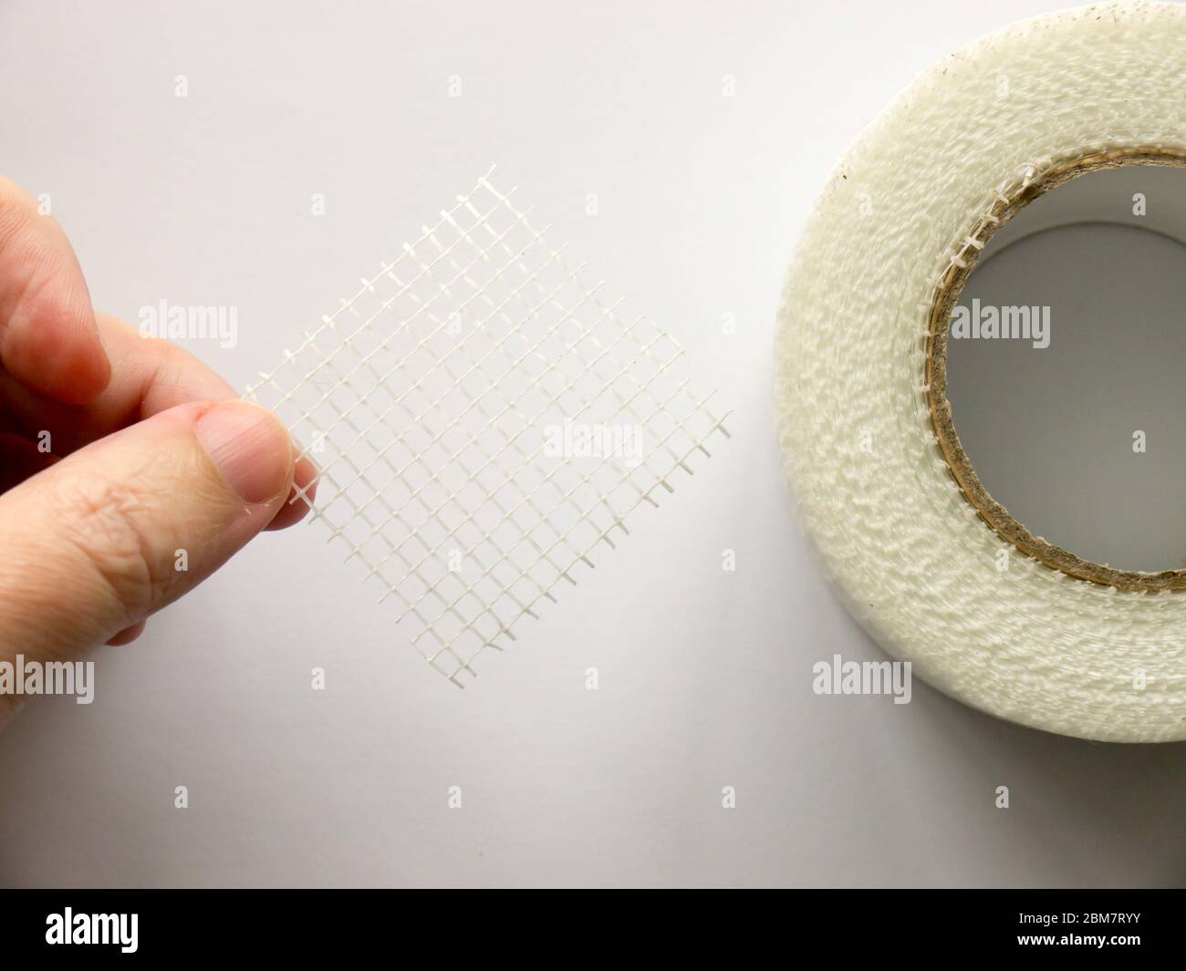 The Sticky yellow mesh tape Stock Photo - Alamy