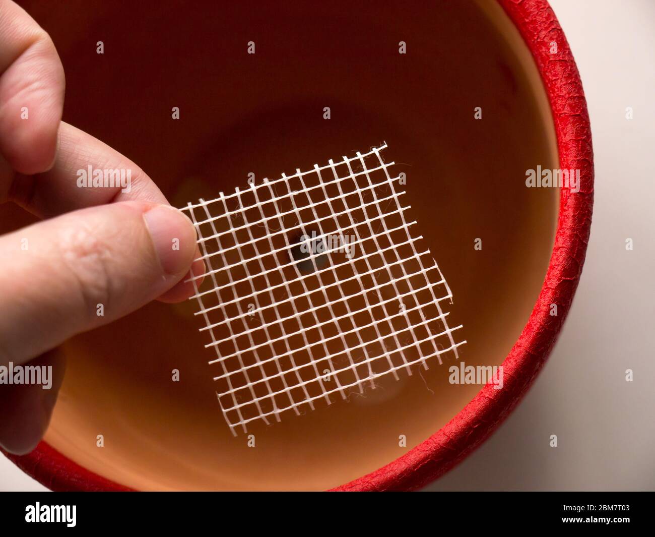The Sticky yellow mesh tape Stock Photo - Alamy