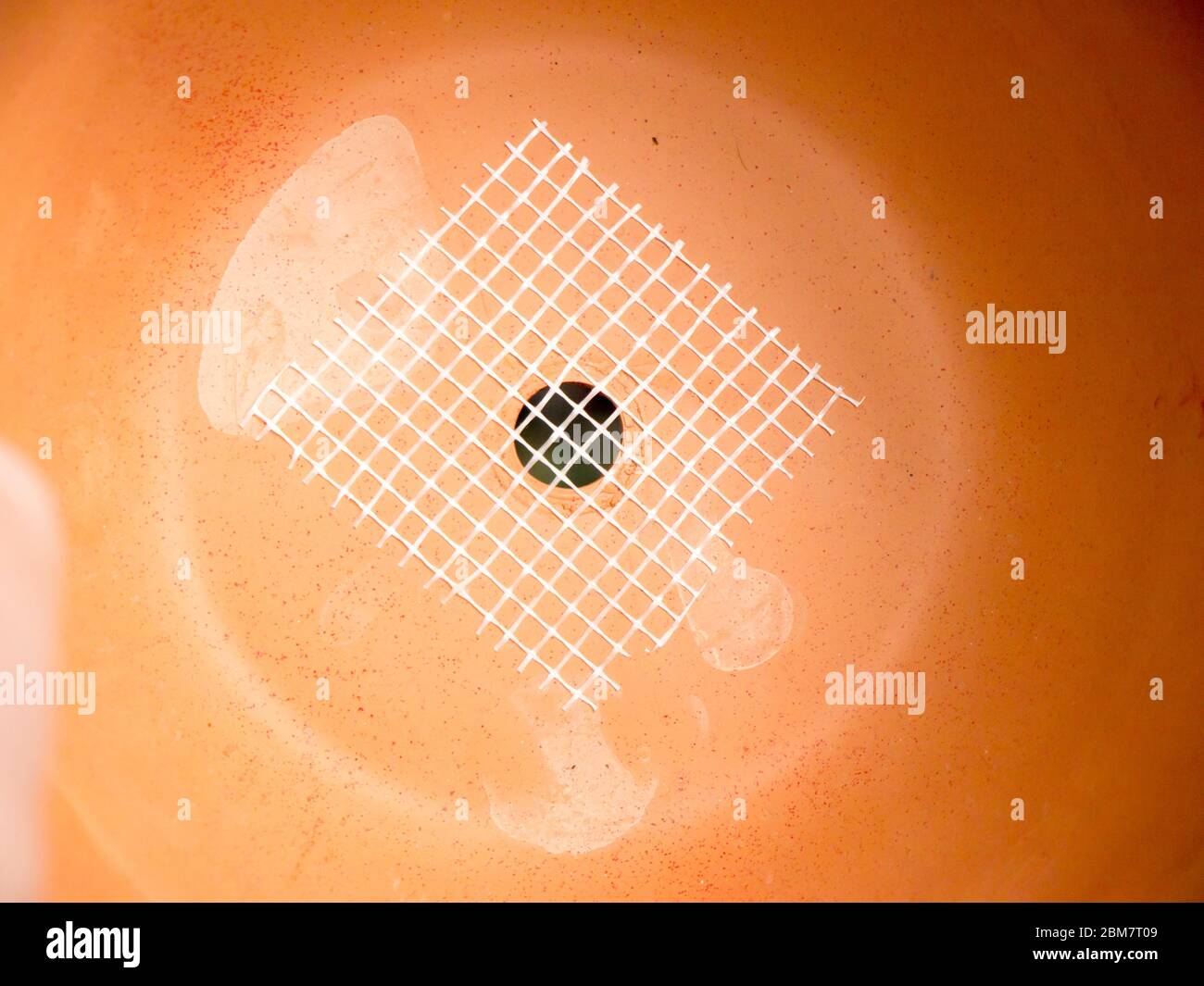 The Sticky yellow mesh tape Stock Photo - Alamy