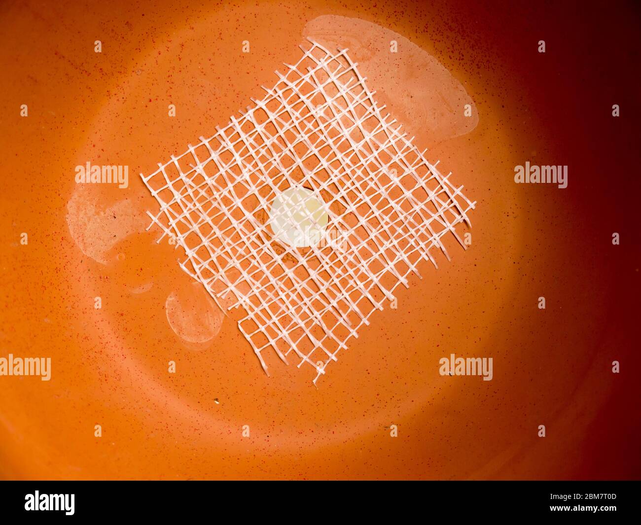 The Sticky yellow mesh tape Stock Photo - Alamy