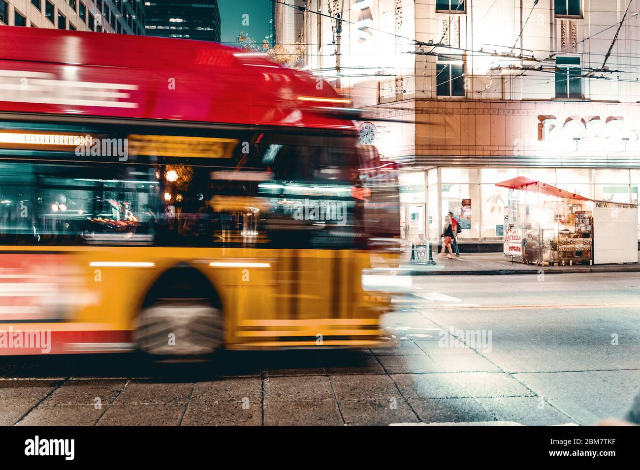 street with blurry bus in Downtown Seattle Stock Photo - Alamy