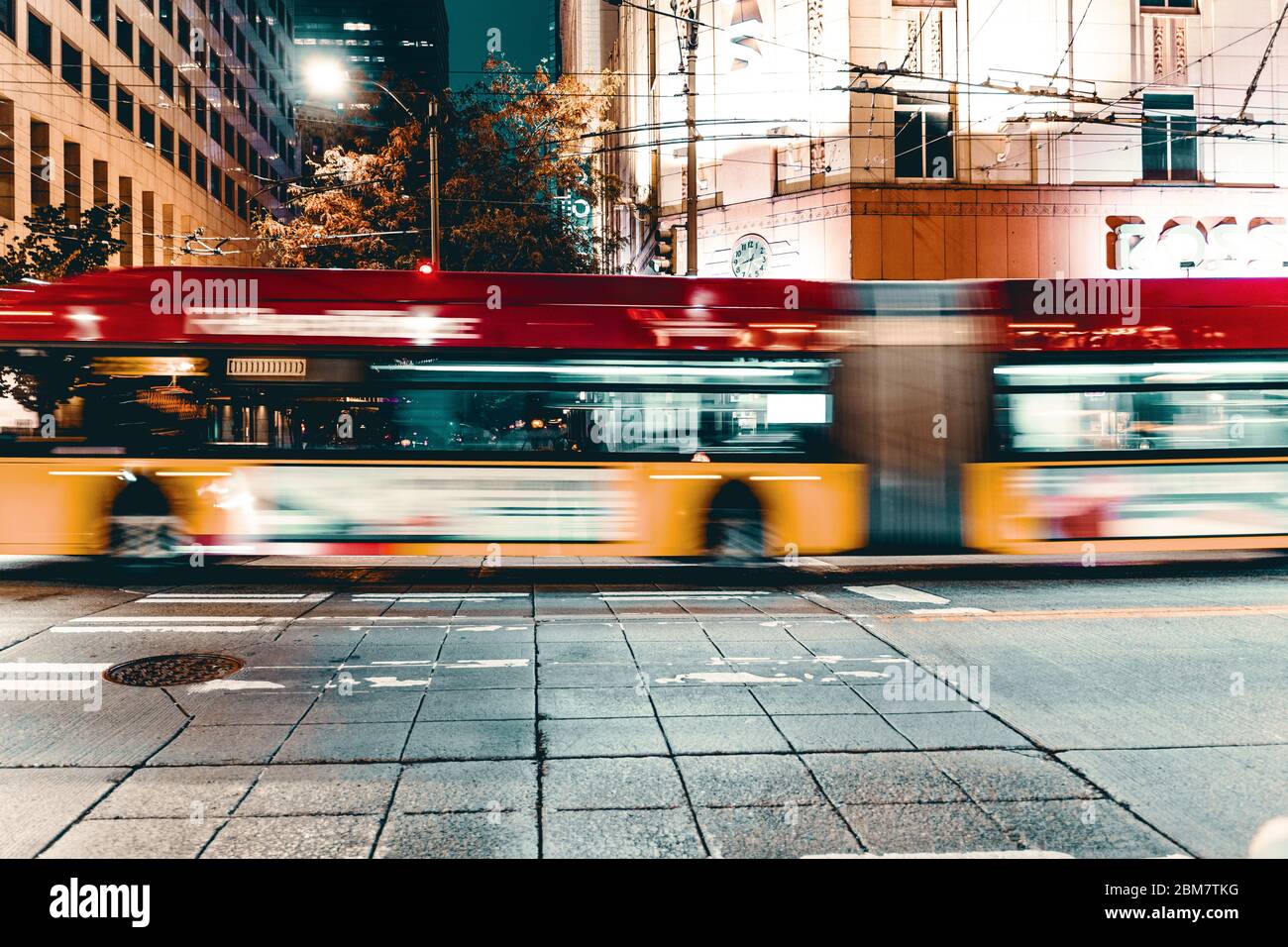 street with blurry bus in Downtown Seattle Stock Photo - Alamy